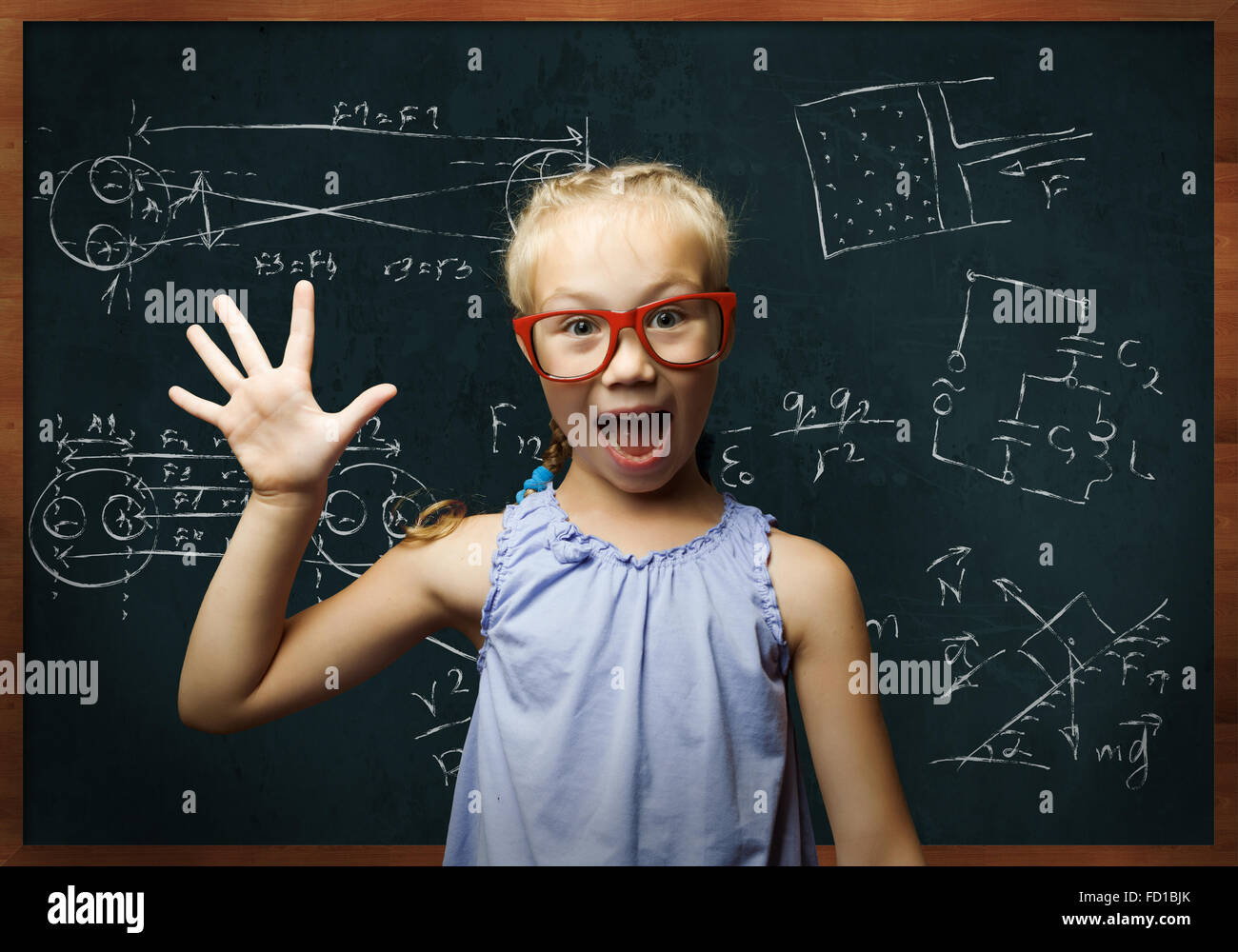 Genius girl in red glasses near blackboard with formulas Stock Photo ...