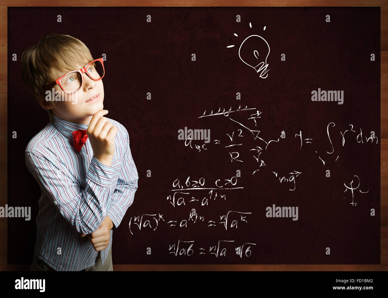 Smart boy in red glasses near blackboard with formulas Stock Photo - Alamy