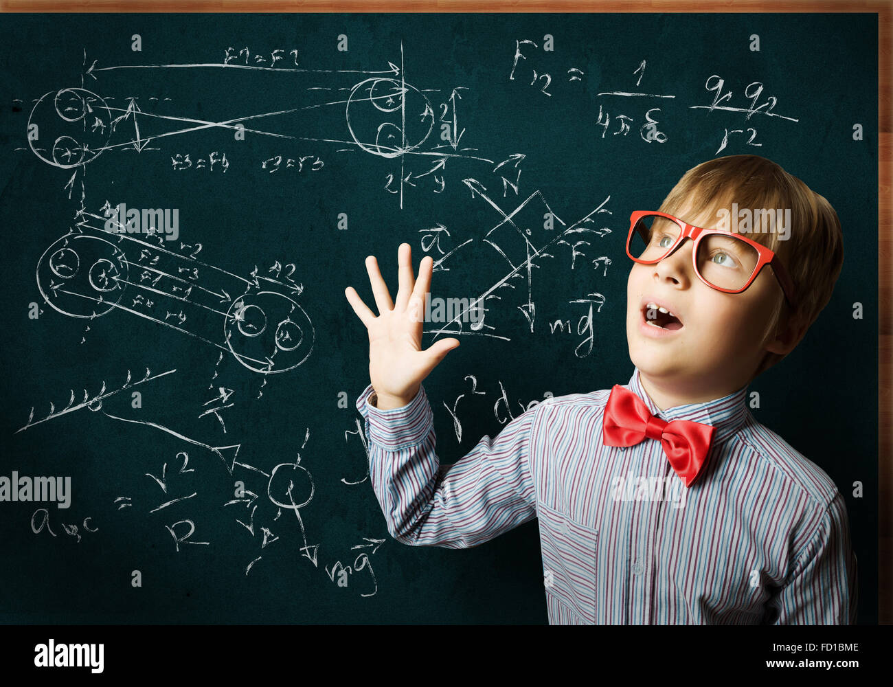 Smart boy in red glasses near blackboard with formulas Stock Photo - Alamy