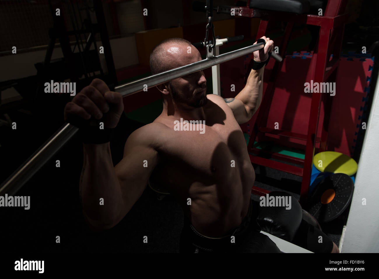 Bodybuilder Doing Back Exercises In The Gym Stock Photo - Alamy