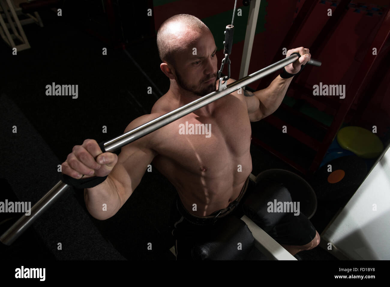 Bodybuilder Doing Back Exercises In The Gym Stock Photo - Alamy