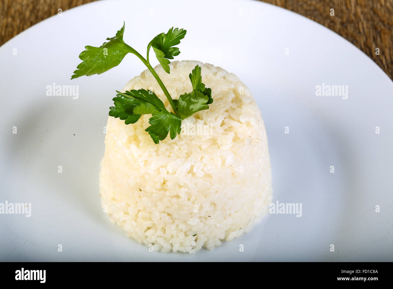 Boiled rice with parsley leaves Stock Photo - Alamy