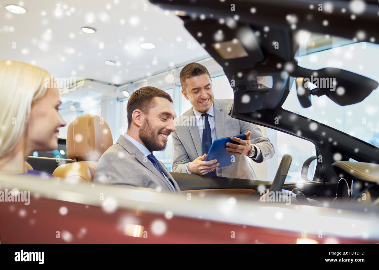 happy couple with car dealer in auto show or salon Stock Photo - Alamy