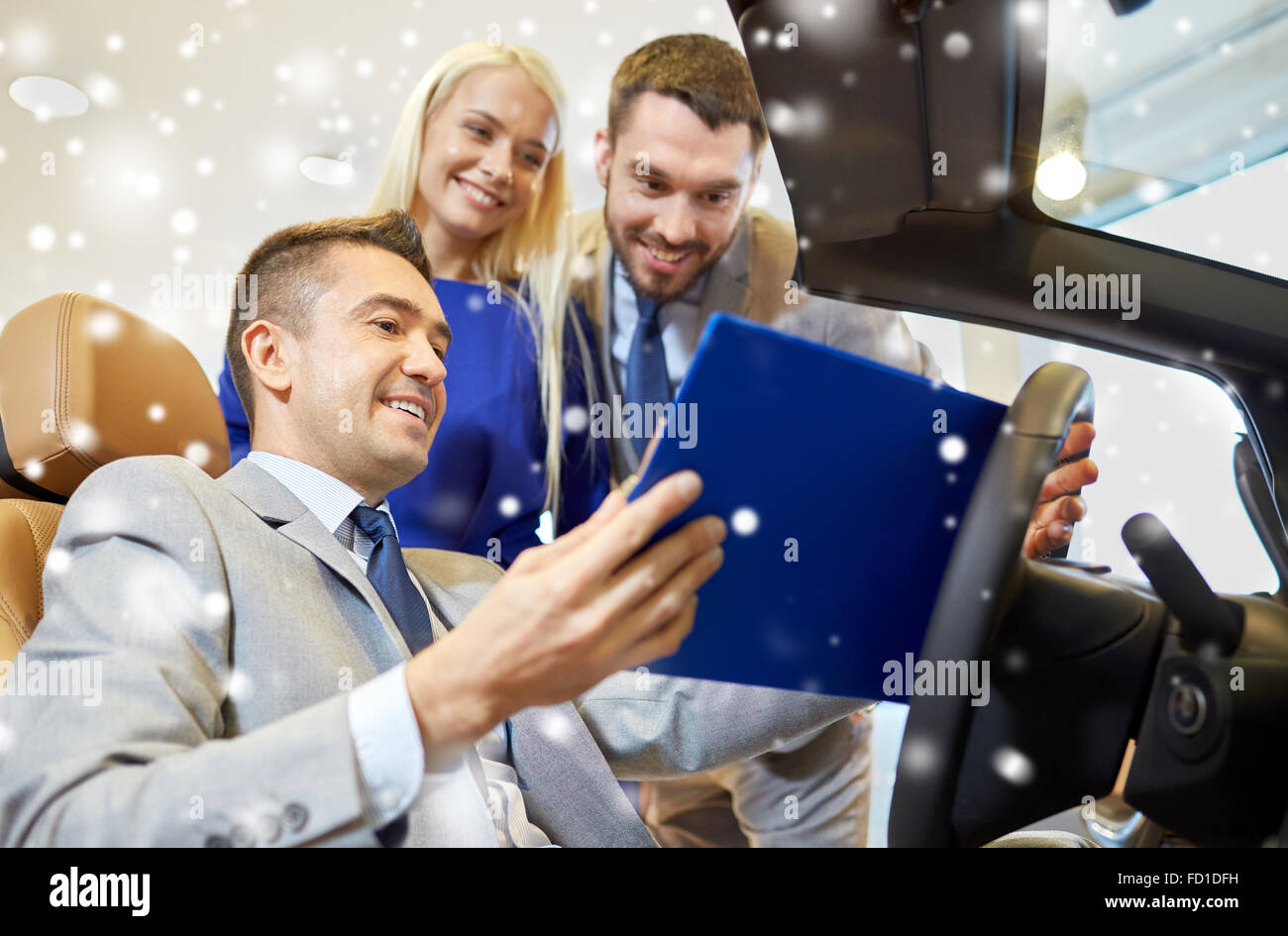 happy couple with car dealer in auto show or salon Stock Photo - Alamy
