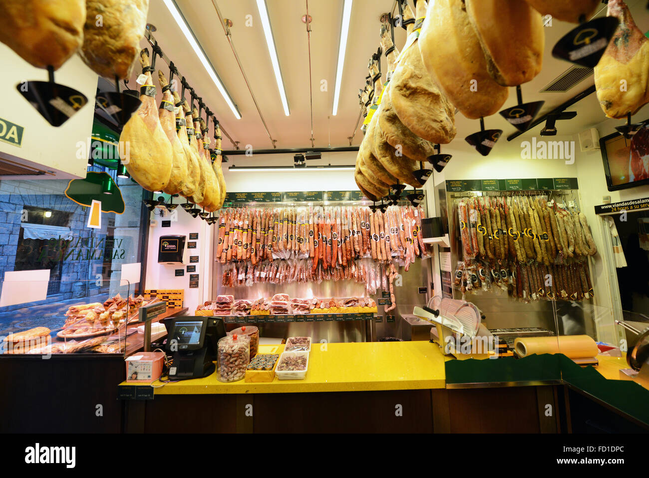 Cured ham hanging in a specialized ham shop in Bilbao, Spain Stock ...