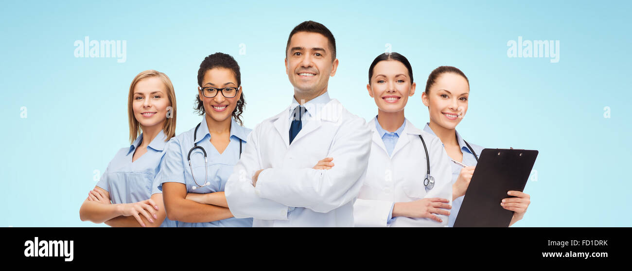 group of smiling doctors with clipboard Stock Photo - Alamy