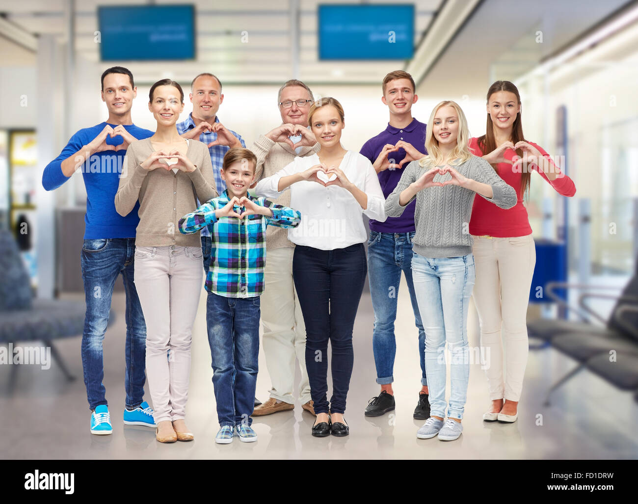 group of smiling people showing heart hand sign Stock Photo - Alamy