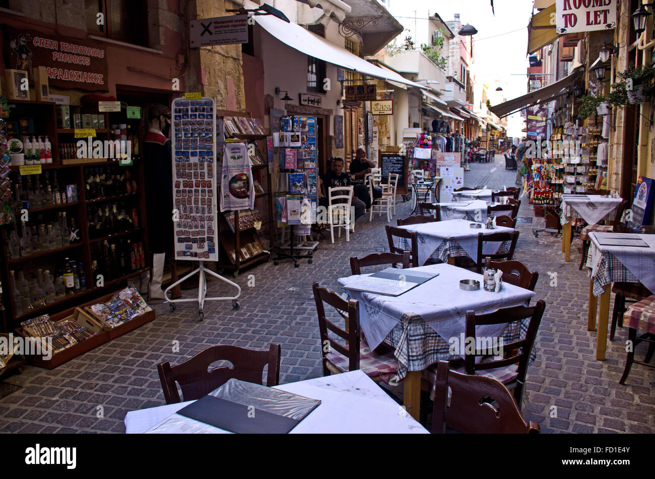 Old town Chania narrow street with souvenir shops and restaurants ...