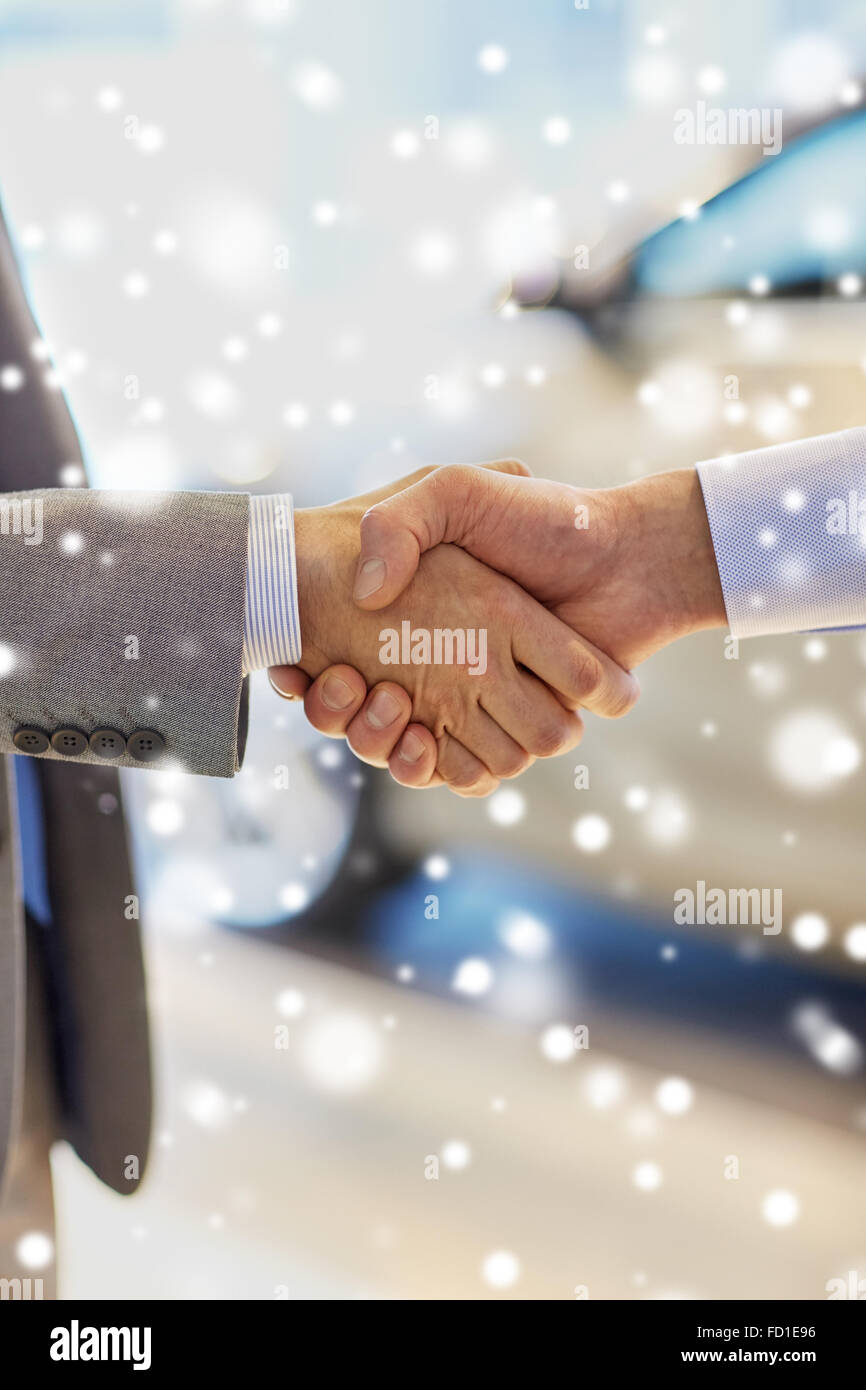 close up of male handshake in auto show or salon Stock Photo - Alamy