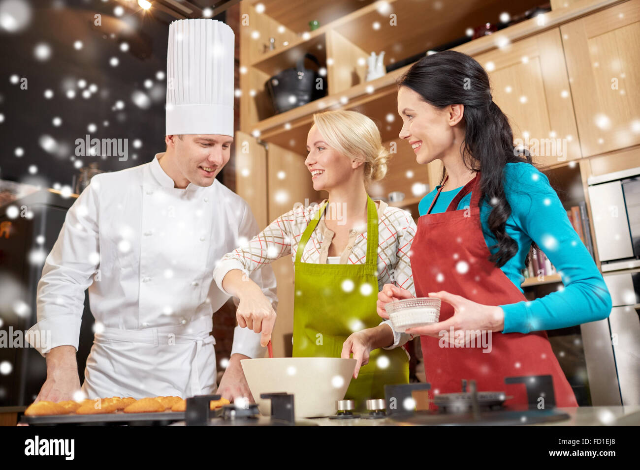 happy women and chef cook baking in kitchen Stock Photo - Alamy
