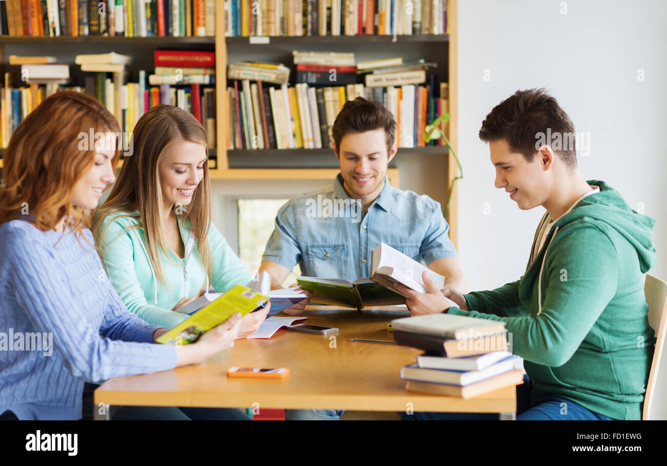 students with books preparing to exam in library Stock Photo - Alamy