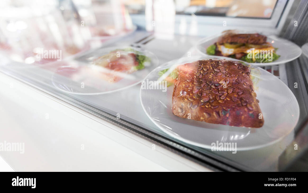 close up of sandwich in cafe showcase or store Stock Photo - Alamy