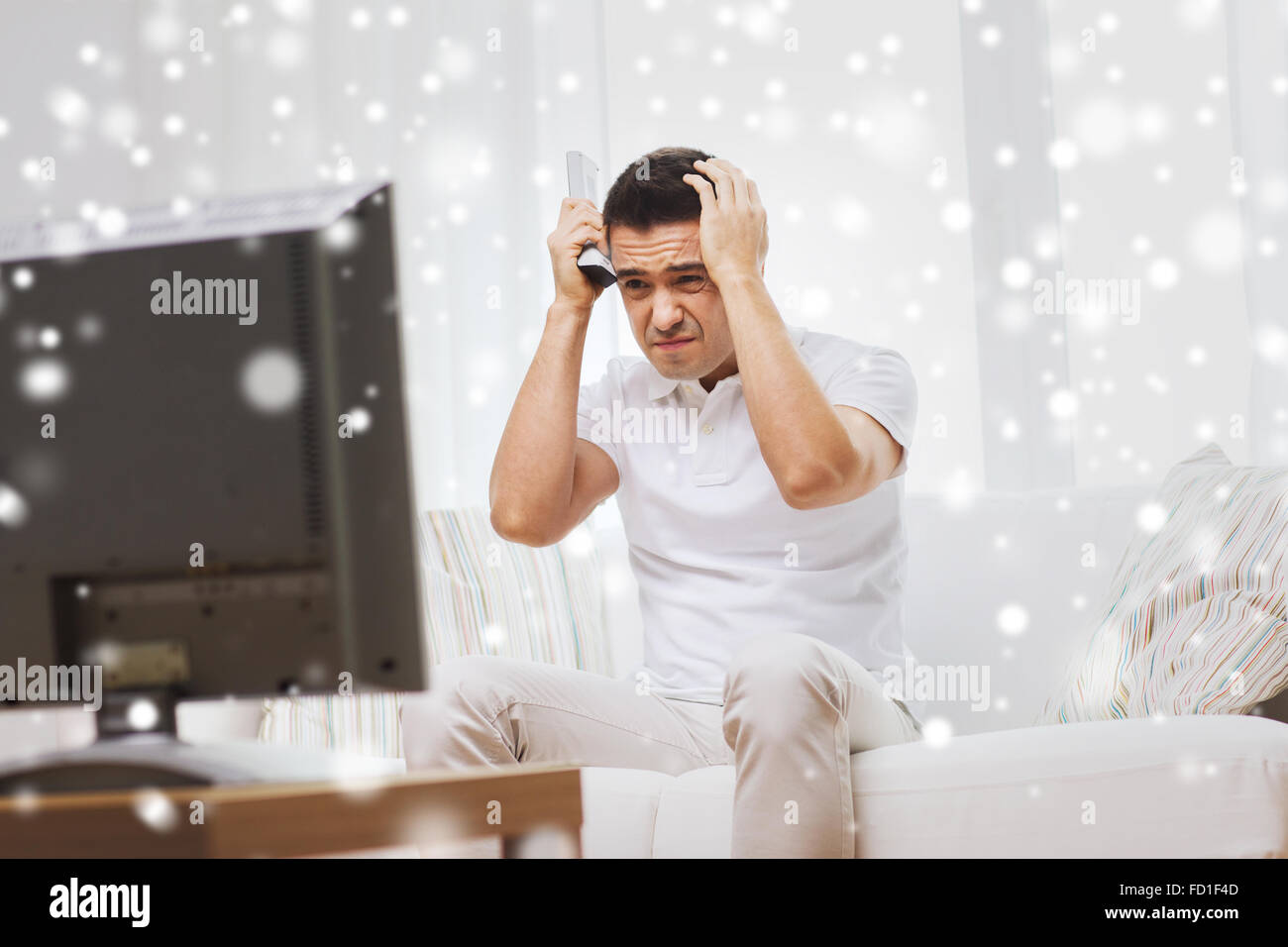 disappointed man watching tv at home Stock Photo - Alamy