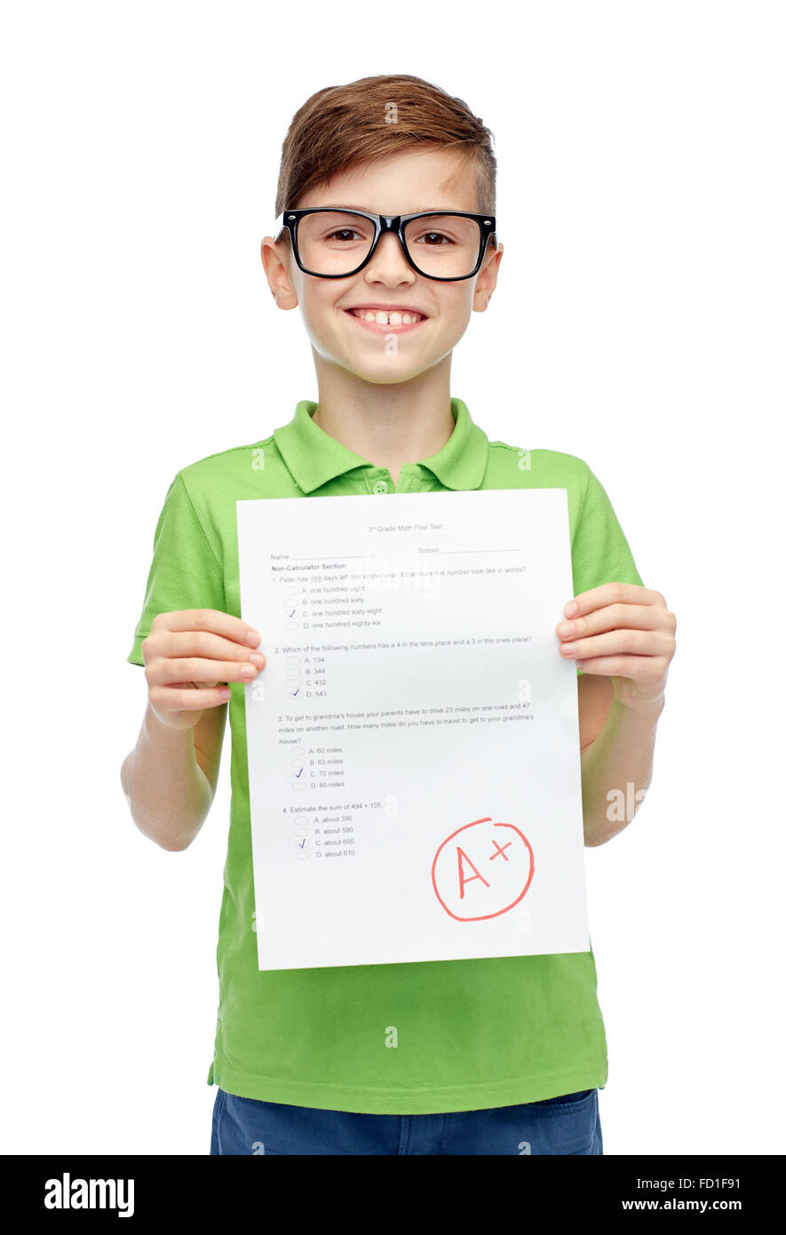 happy boy in eyeglasses holding school test result Stock Photo - Alamy
