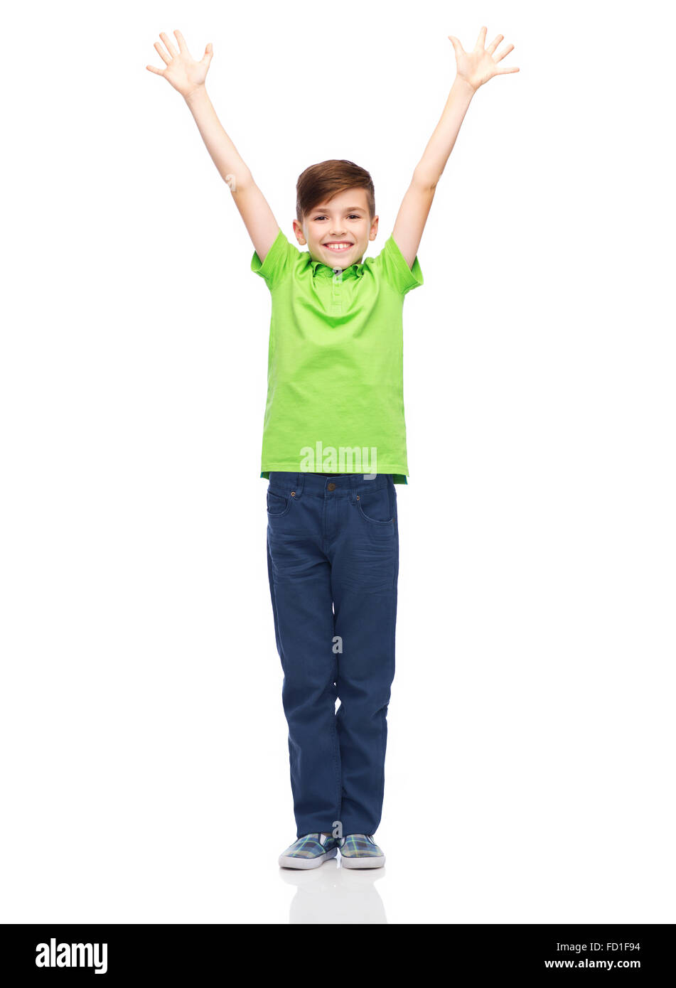 happy boy in polo t-shirt raising hands up Stock Photo - Alamy