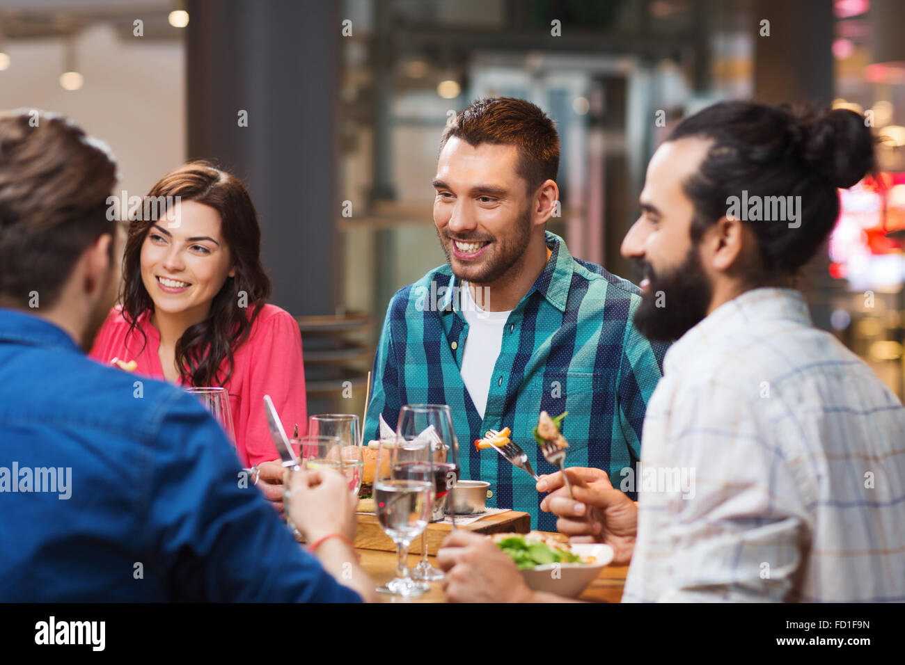 happy friends having dinner at restaurant Stock Photo - Alamy