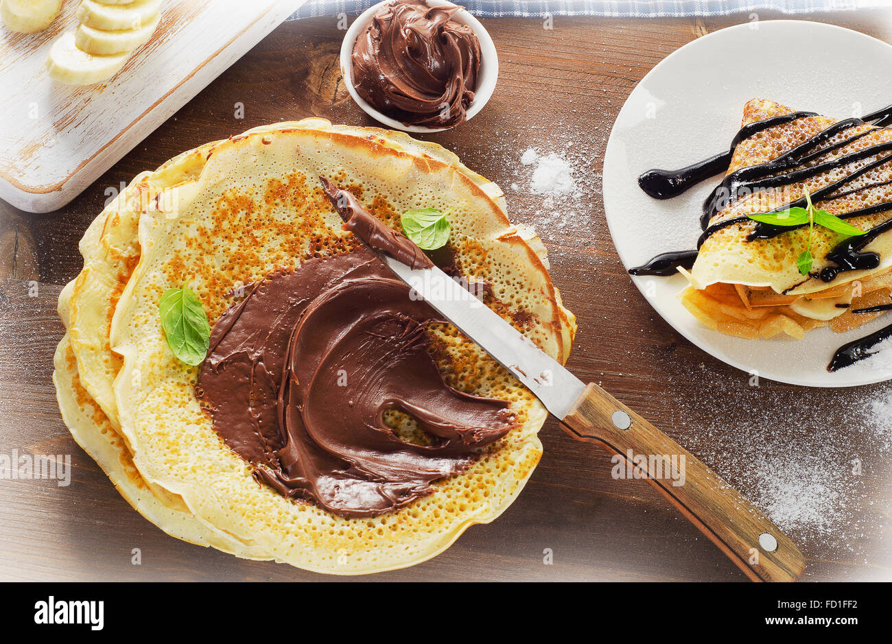 Sweet Crepes with chocolate cream. Top view Stock Photo - Alamy