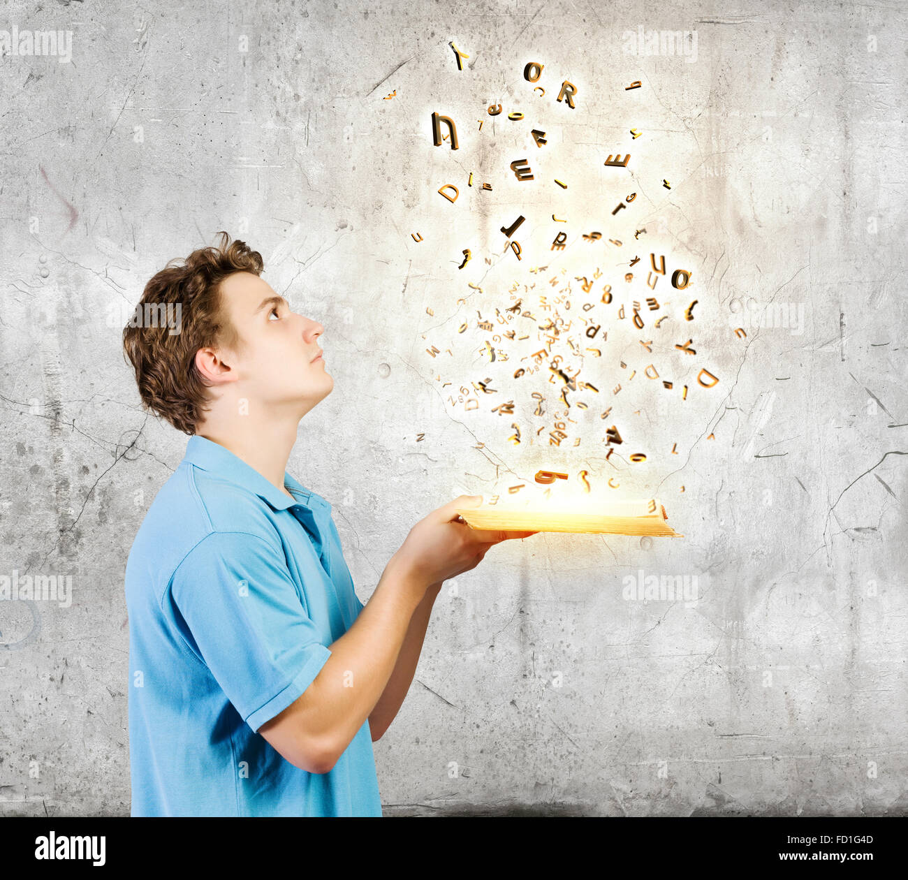 Young man with opened book and characters flying out Stock Photo - Alamy