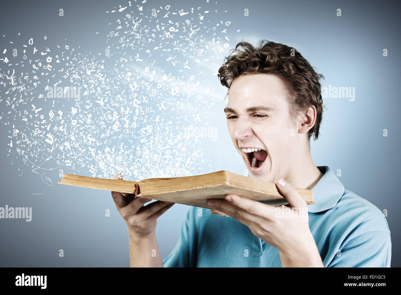 Young man with opened book and characters flying out Stock Photo - Alamy