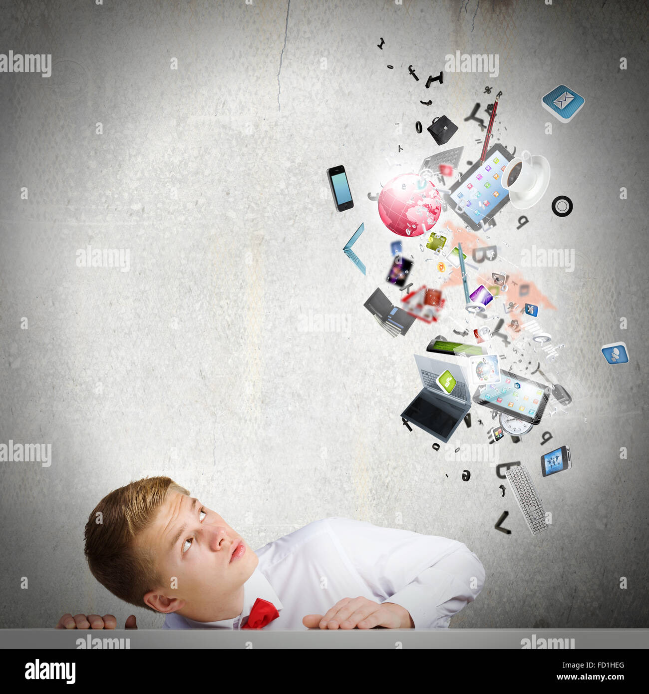Young man looking out from under the table Stock Photo - Alamy