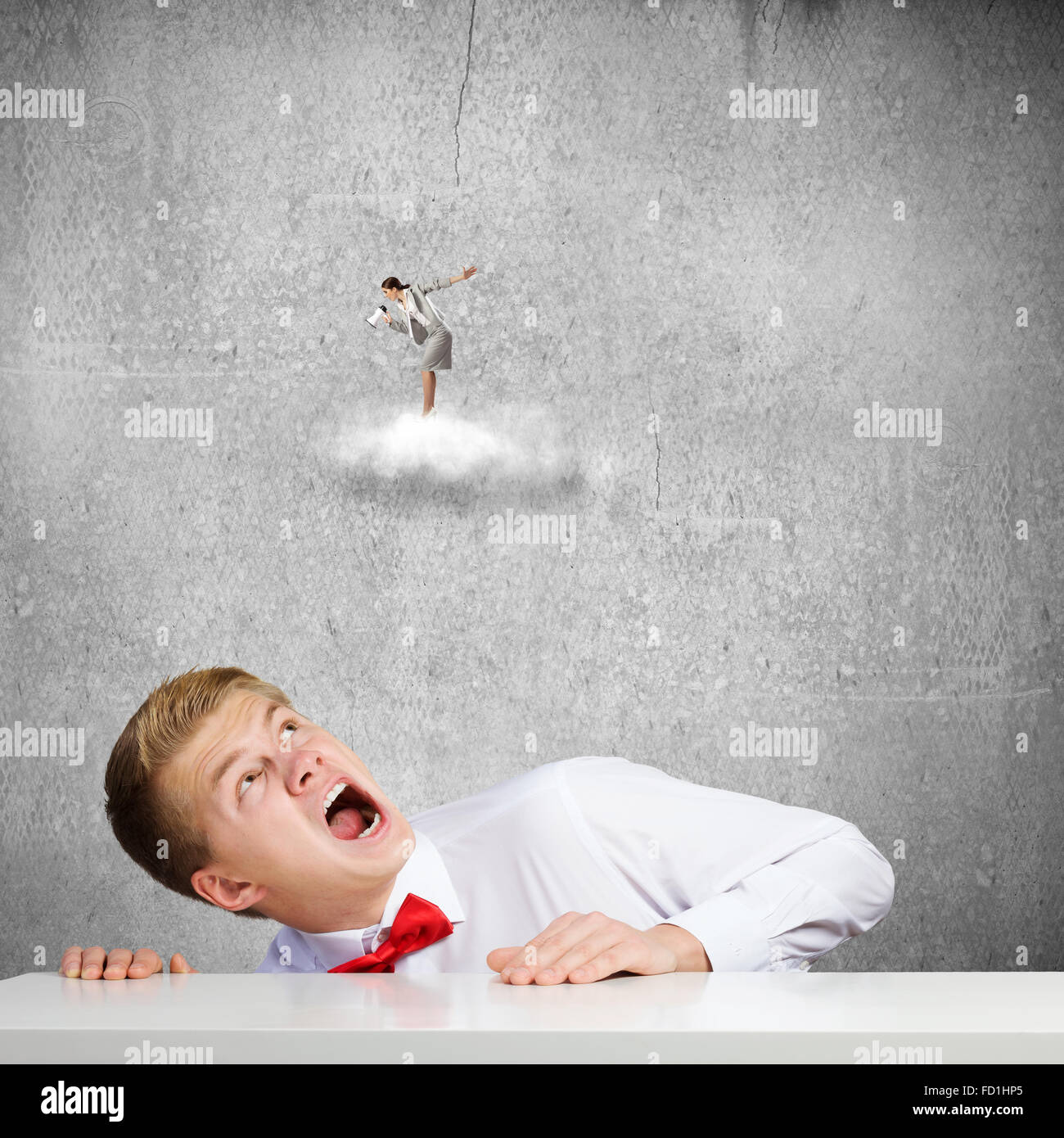 Businessman screaming at businesswoman standing on cloud Stock Photo ...