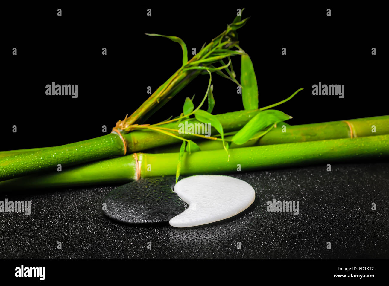 beautiful spa setting of symbol Yin Yang stones and natural bamboo ...