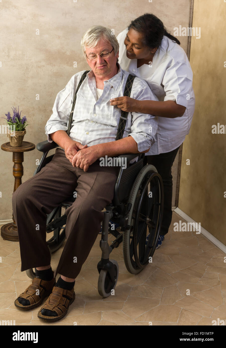 Grumpy old grandpa in nursing home receiving medication by a nurse ...