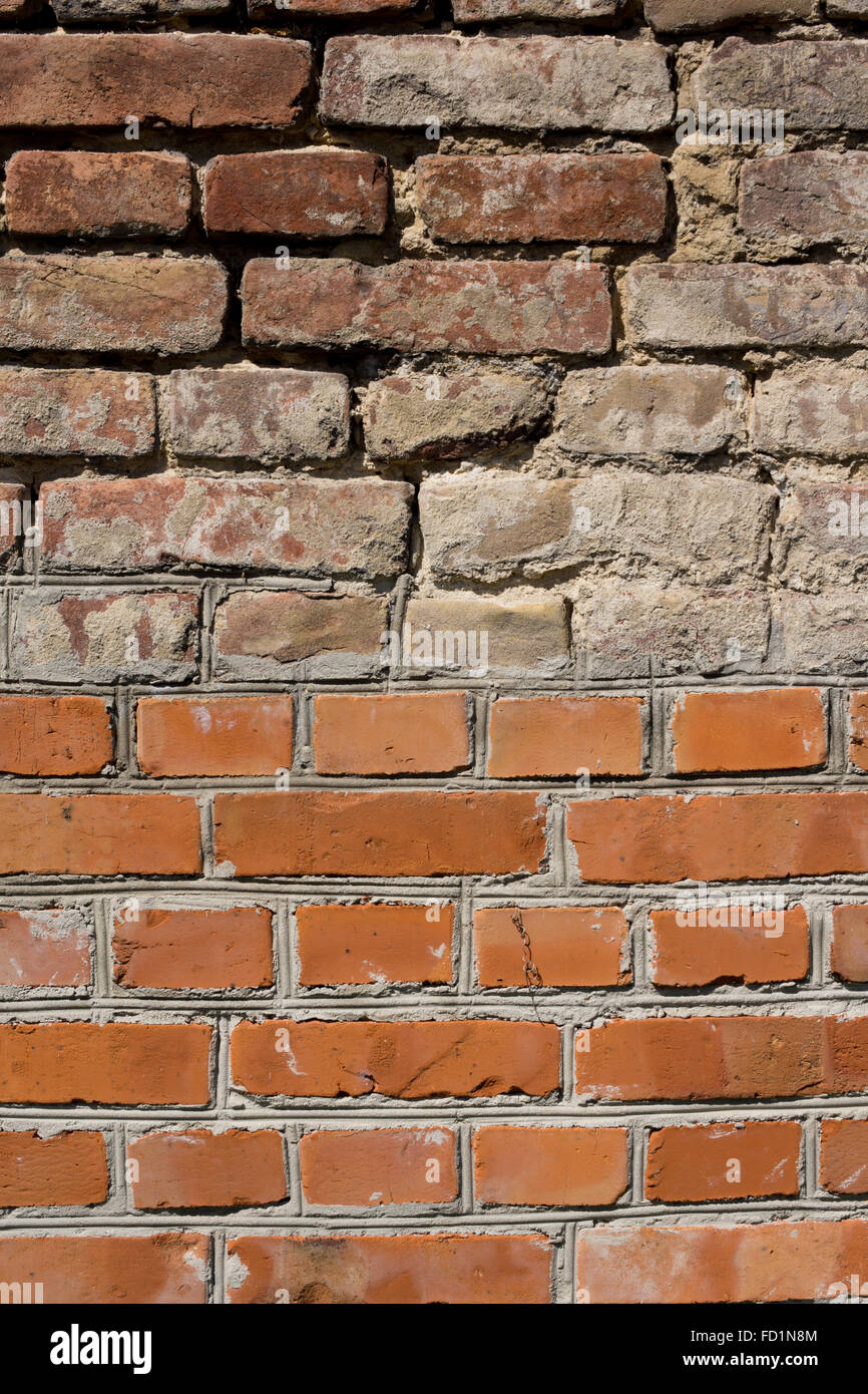 wall made in half from new bricks and other half from old bricks Stock Photo - Alamy