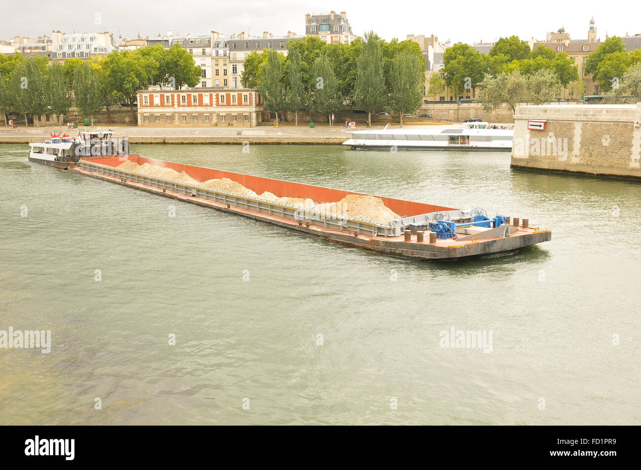 Barge navigates the Seine river in Paris, France Stock Photo - Alamy