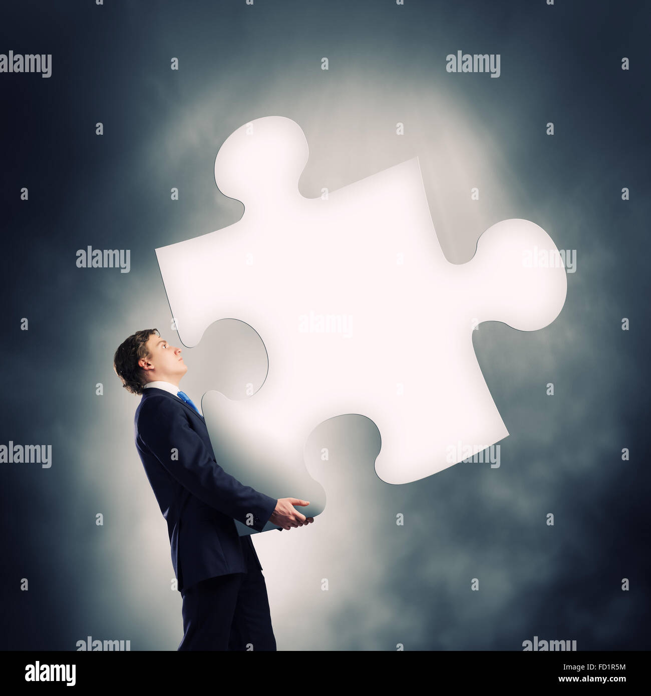 Business teamwork building big puzzle hi-res stock photography and ...