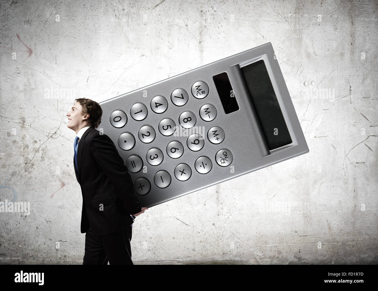 Young businessman carrying huge calculator in hands Stock Photo - Alamy