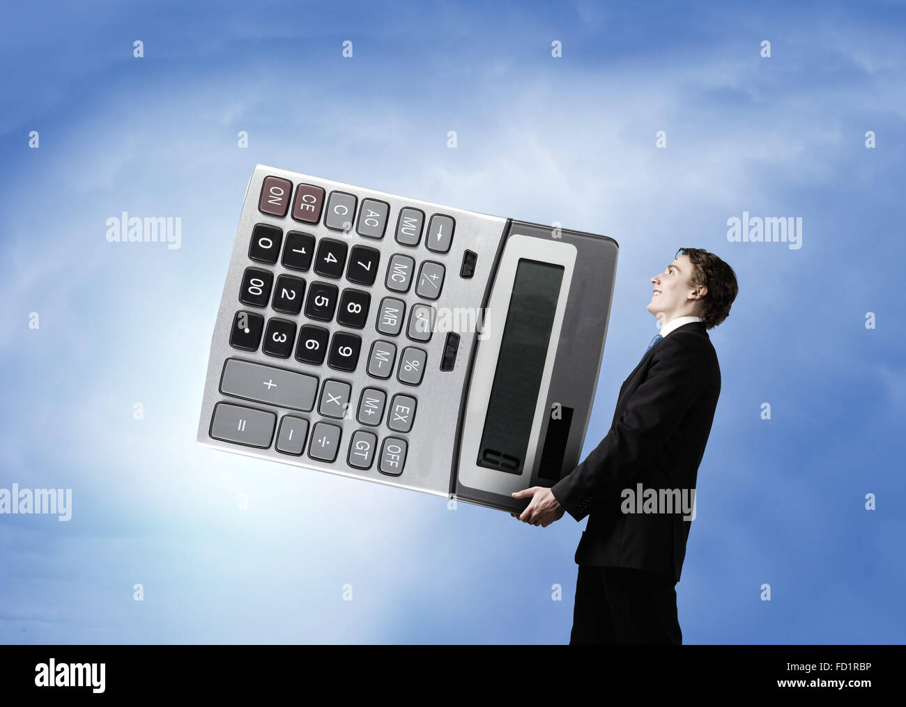 Young businessman carrying huge calculator in hands Stock Photo - Alamy