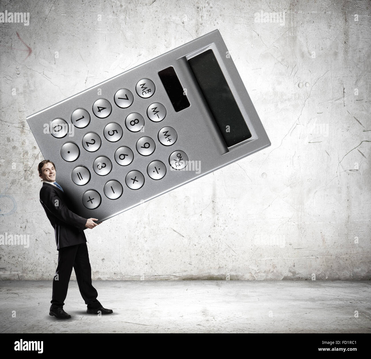 Young businessman carrying huge calculator in hands Stock Photo - Alamy