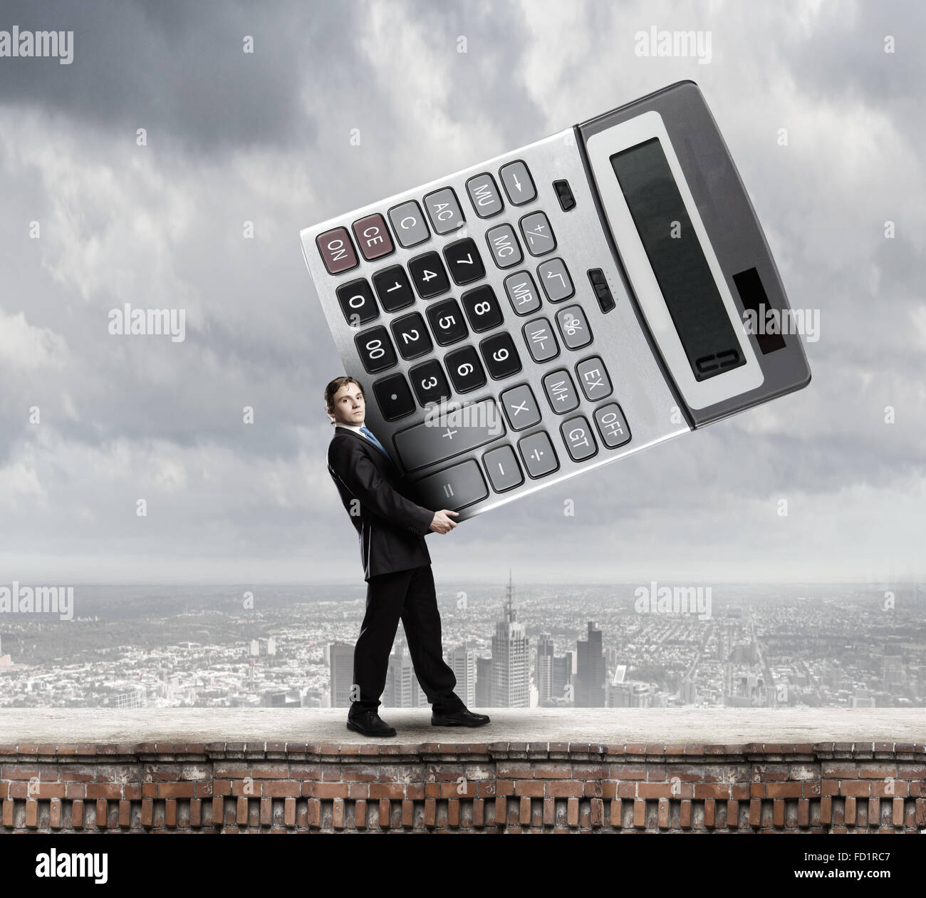 Young businessman carrying huge calculator in hands Stock Photo - Alamy