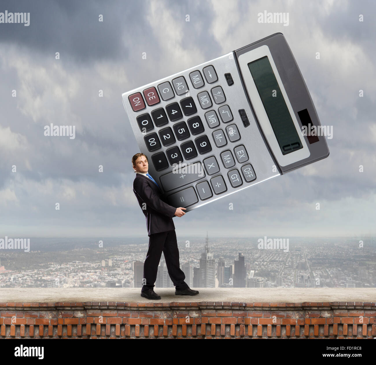Young businessman carrying huge calculator in hands Stock Photo - Alamy