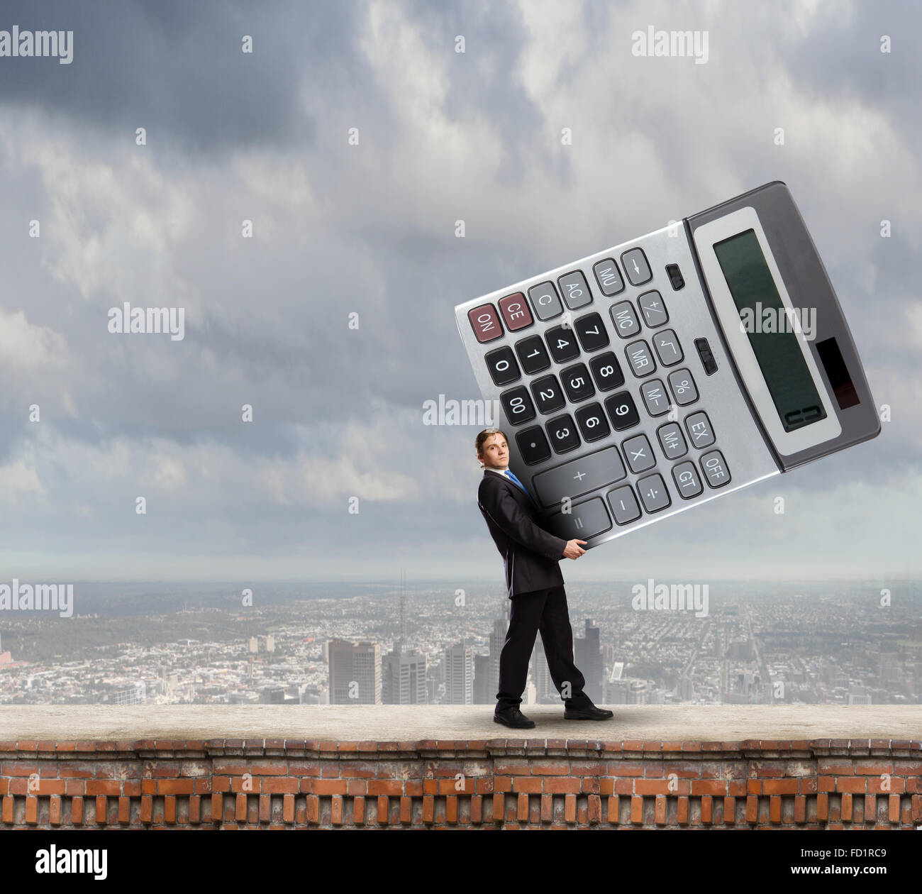 Young businessman carrying huge calculator in hands Stock Photo - Alamy