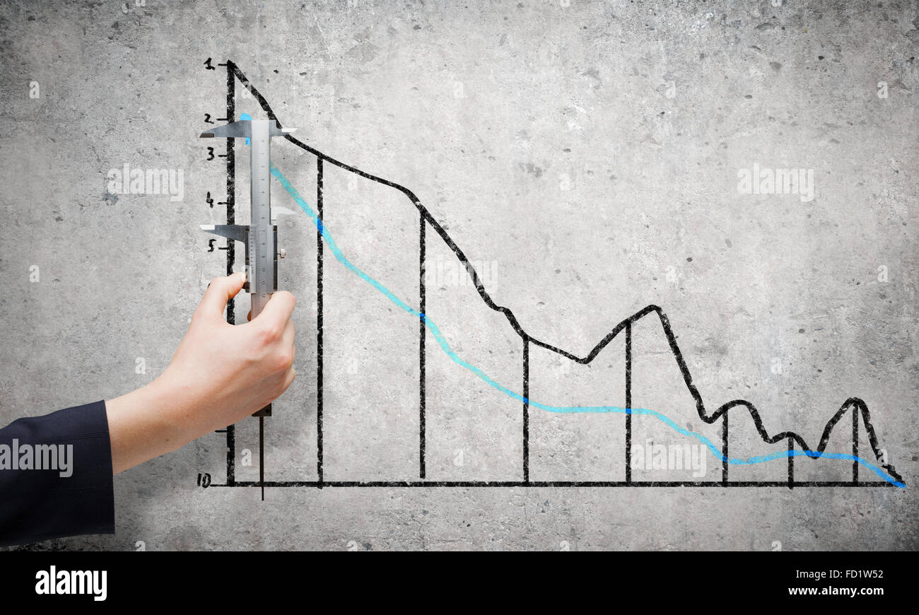 Close up of female hand measuring graph with ruler Stock Photo - Alamy