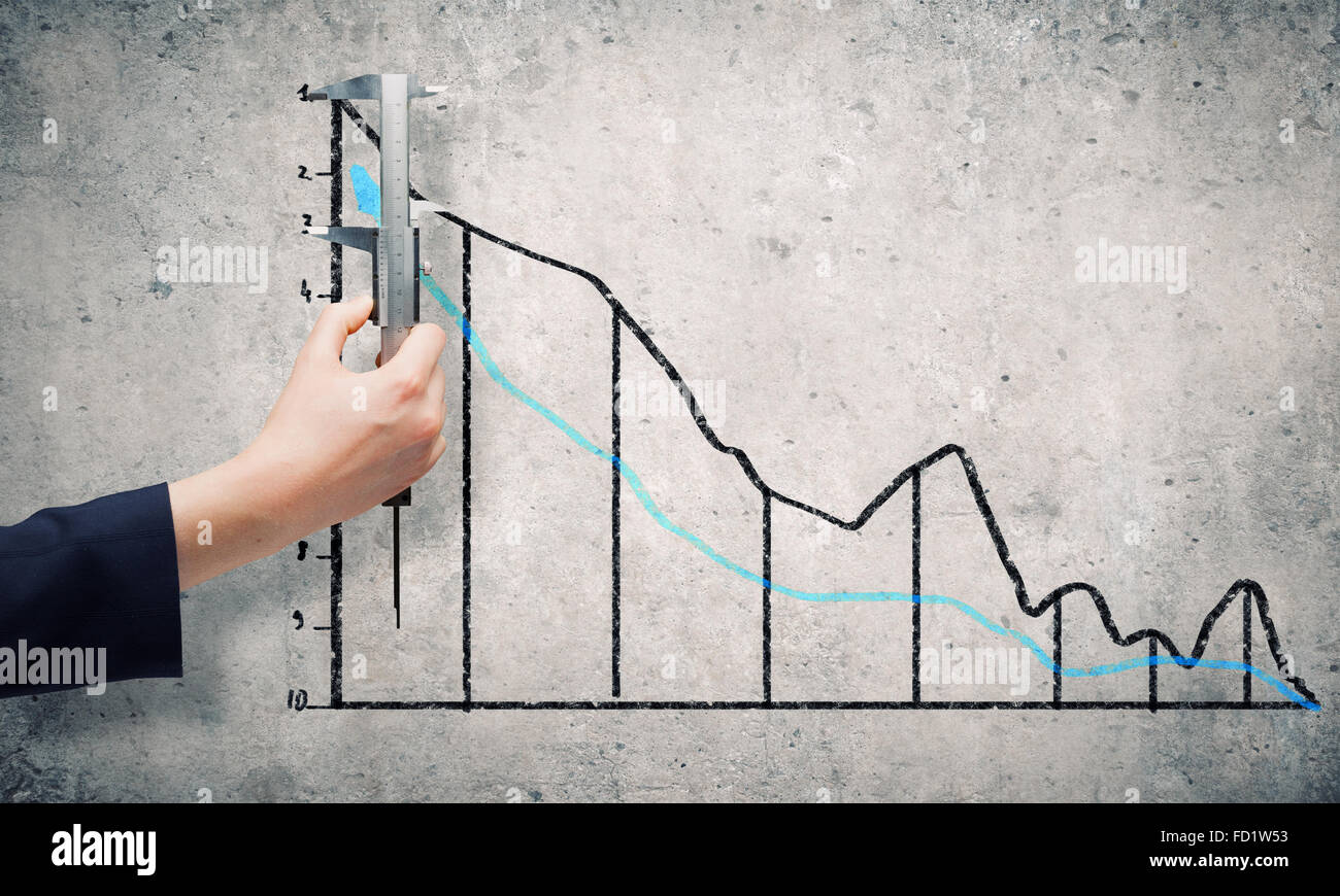 Close up of female hand measuring graph with ruler Stock Photo - Alamy