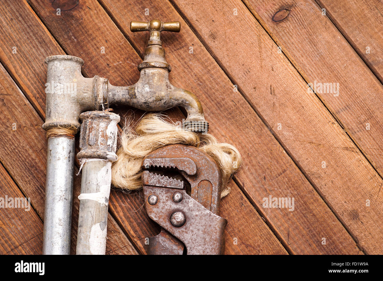 plumbing tools lying with old pipes and faucets Stock Photo - Alamy
