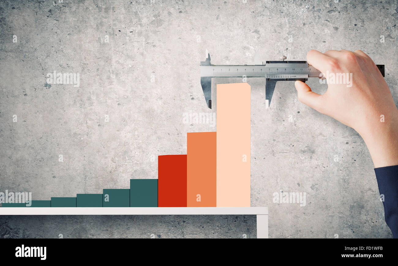 Close up of female hand measuring graph with ruler Stock Photo - Alamy