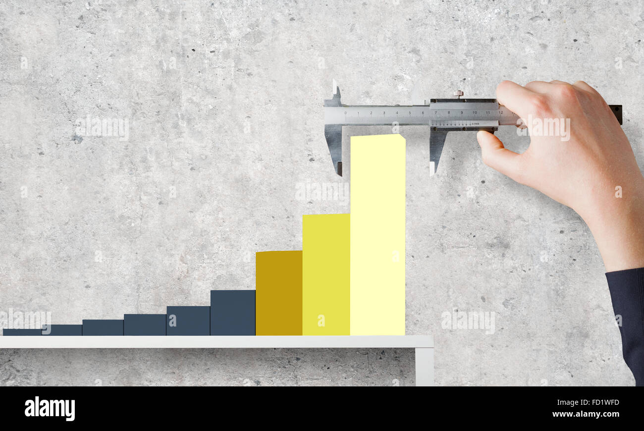 Close up of female hand measuring graph with ruler Stock Photo - Alamy