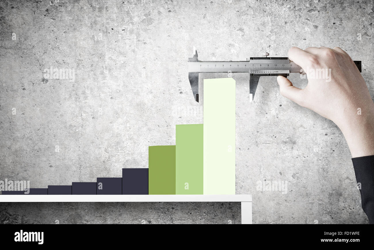 Close up of female hand measuring graph with ruler Stock Photo - Alamy