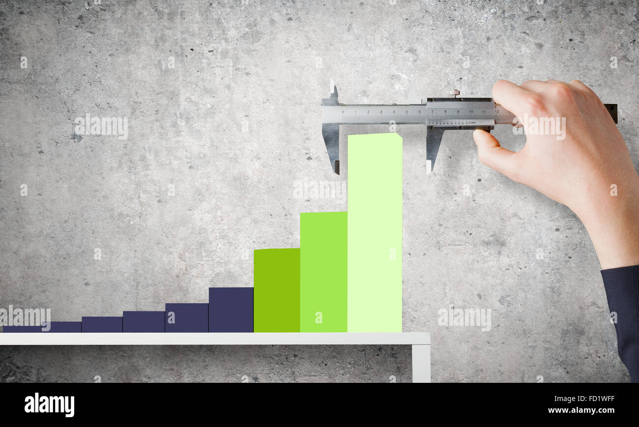 Close up of female hand measuring graph with ruler Stock Photo - Alamy