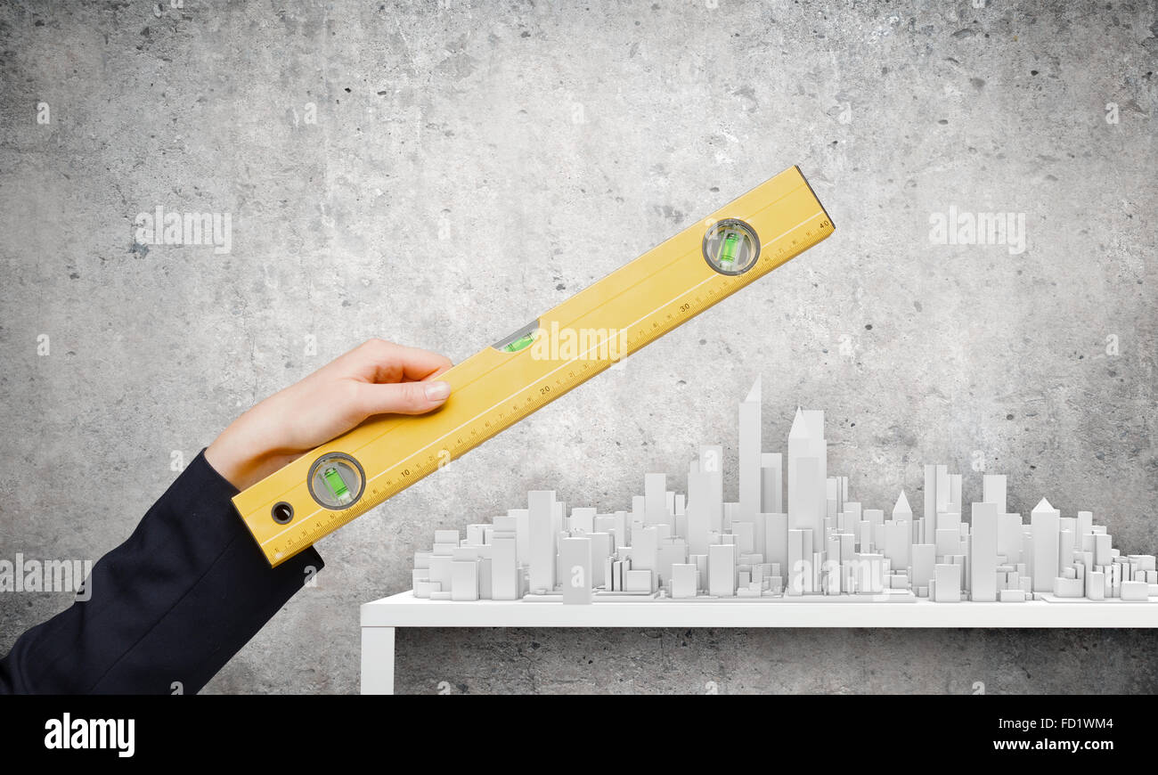 Close up of female hand measuring construction project with ruler Stock ...