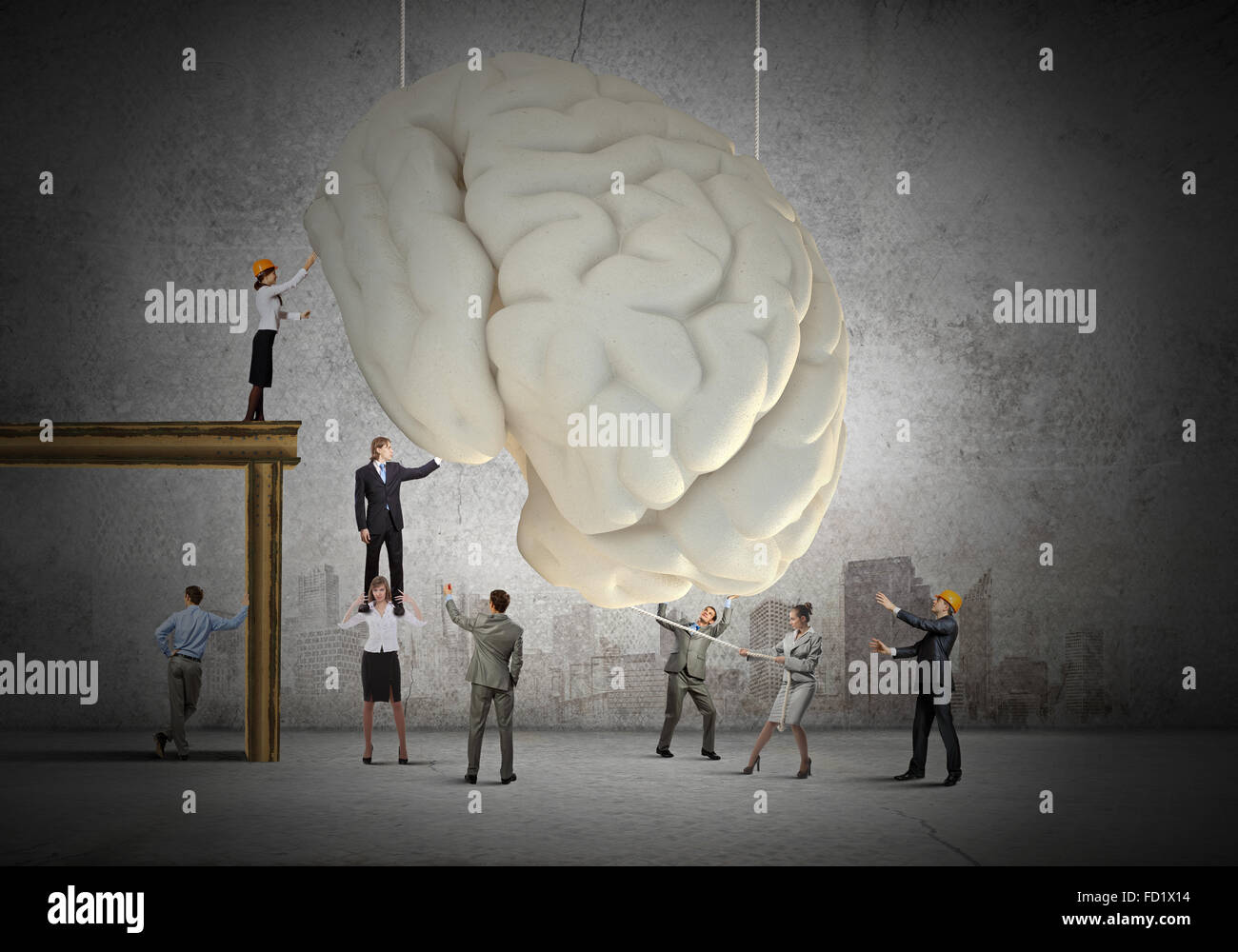 Huge human brain and many little businesspeople around Stock Photo - Alamy