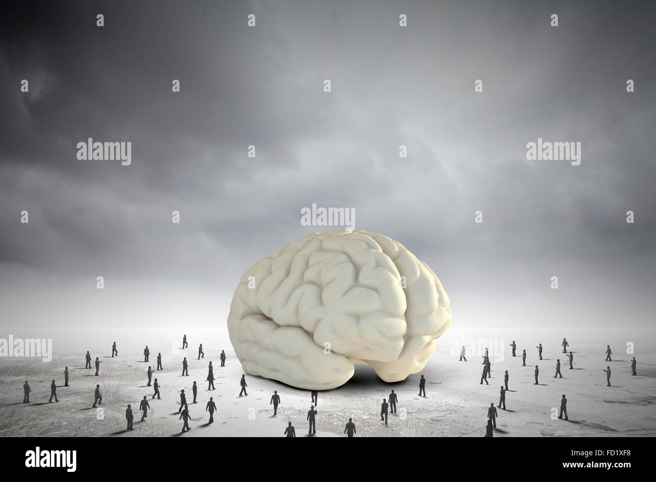 Huge human brain and many little businesspeople around Stock Photo - Alamy