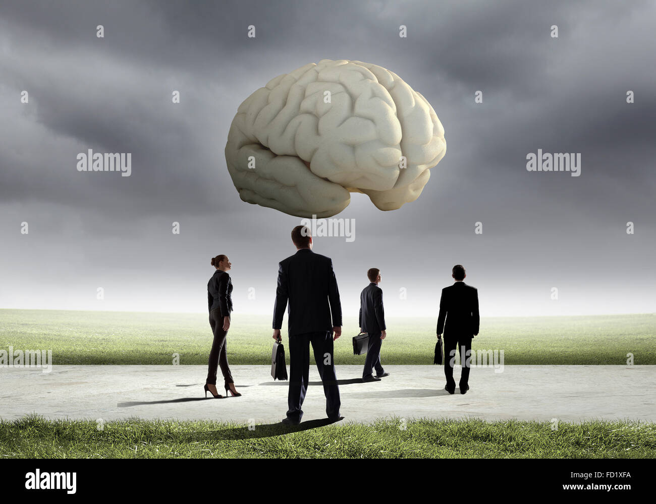 Huge human brain and many little businesspeople around Stock Photo - Alamy