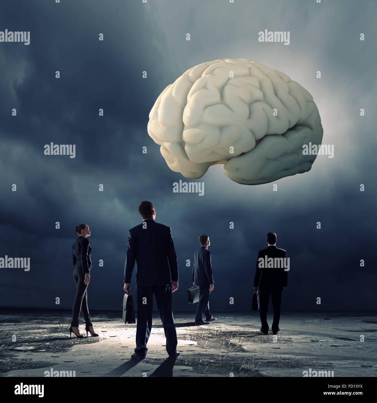 Huge human brain and many little businesspeople around Stock Photo - Alamy