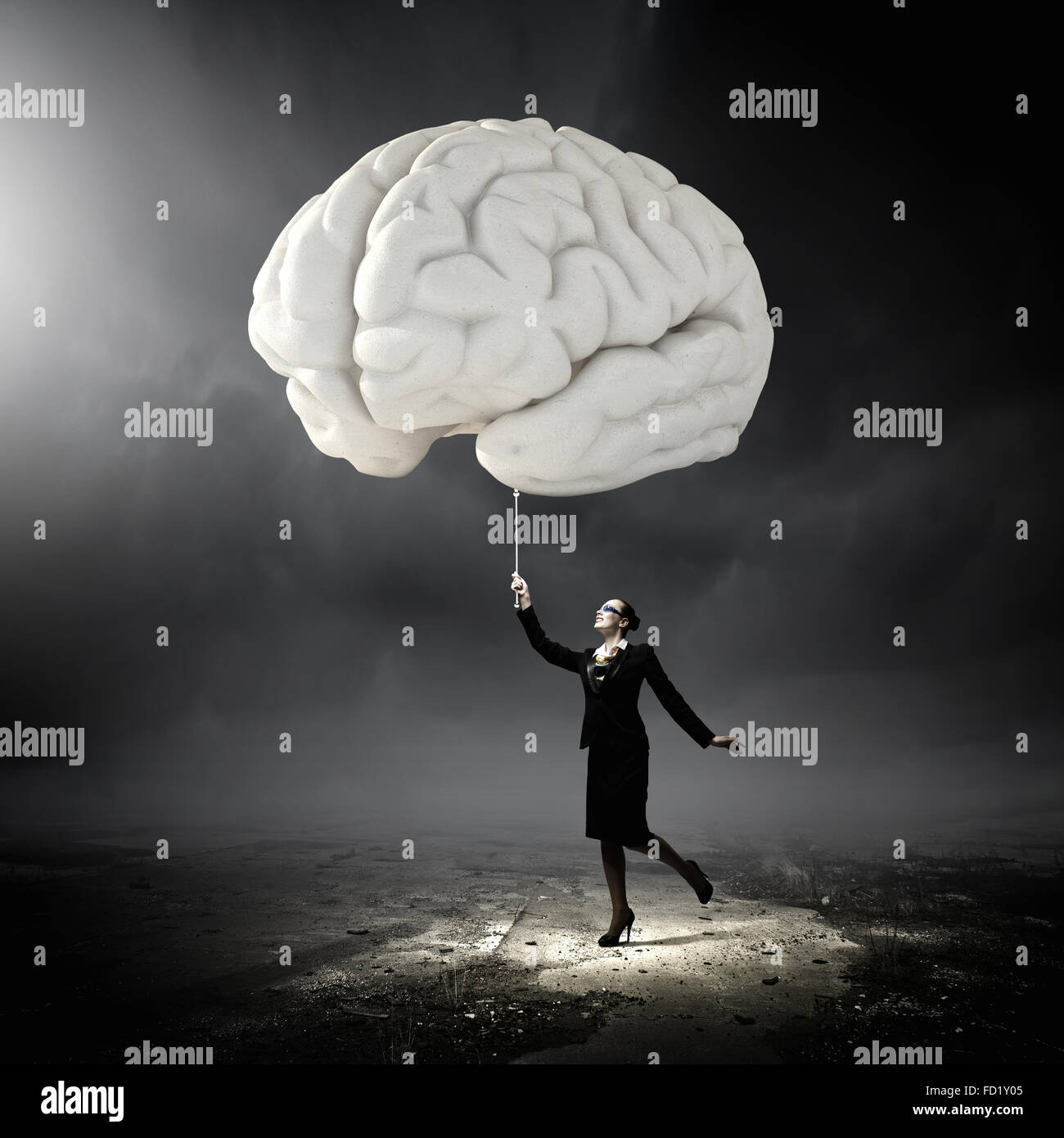 Huge human brain and young businesswoman in glasses Stock Photo - Alamy