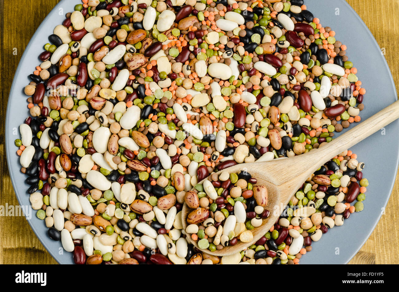 legumes in a dish on wood, close up, background Stock Photo - Alamy